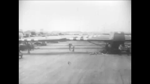 1944- Airmen load cargo into planes, pre... | Stock Video | Pond5