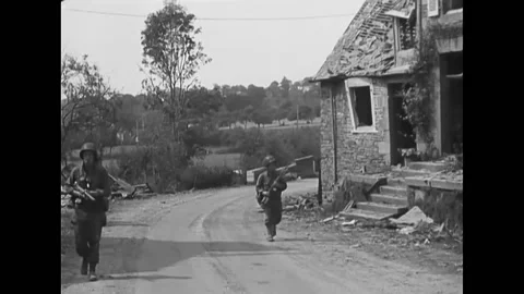 1944 - American troops walk through a wr... | Stock Video | Pond5