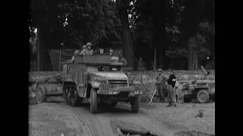 1944 - A US Army armored column drives o... | Stock Video | Pond5