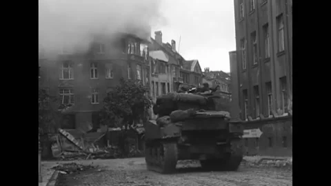 1944 - US Army tanks roll through the wa... | Stock Video | Pond5