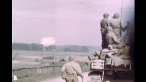 1945 - American soldiers drive tanks pas... | Stock Video | Pond5