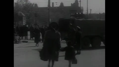 1945 - German civilians gather around a ... | Stock Video | Pond5