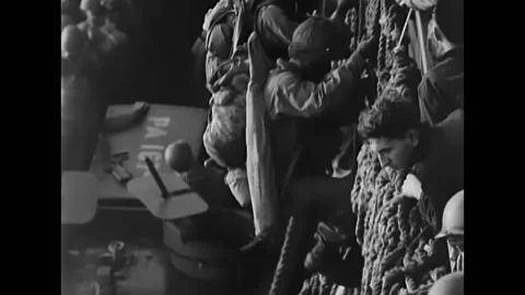 1945 - Soldiers climb into landing craft... | Stock Video | Pond5