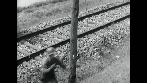 1945 - US signalmen climb the poles alon... | Stock Video | Pond5
