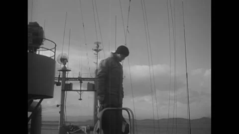1950 - Man on ship signals with flags du... | Stock Video | Pond5