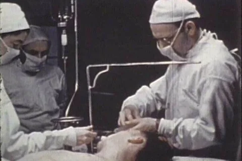 1950 - Surgeons prep their tools and the... | Stock Video | Pond5