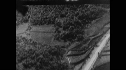 1950s: Aerial view of attack. Hand on co... | Stock Video | Pond5