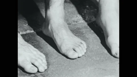 1950s: Bare feet lined up together. Five... | Stock Video | Pond5