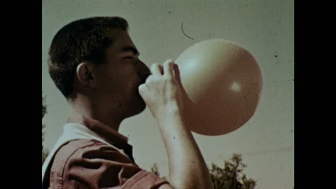 Boy Blowing Up A Balloon Stock Videos – Royalty-Free HD & 4K Videos