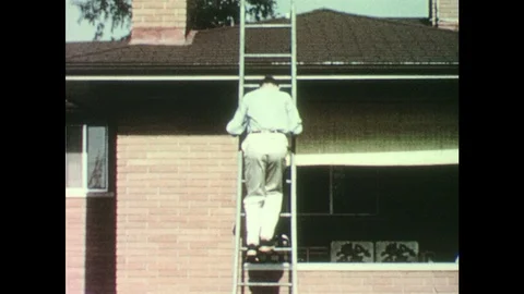 1950s: Boy climbs down ladder, moves boa... | Stock Video | Pond5