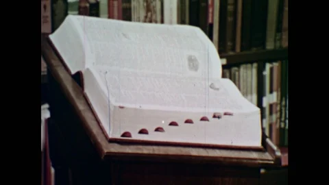 1950s: boy flicking through large dictio... | Stock Video | Pond5