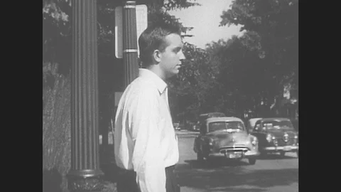 1950s: Boy at street corner. View of tra... | Stock Video | Pond5