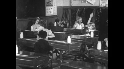 1950s: Boys pass out milk and students s... | Stock Video | Pond5