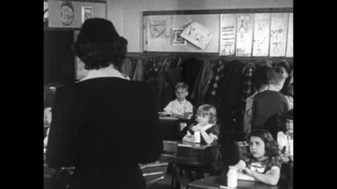 1950s: Boys pass out milk and students s... | Stock Video | Pond5
