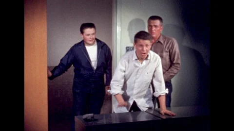 1950s: Boys run into room with man. Man ... | Stock Video | Pond5