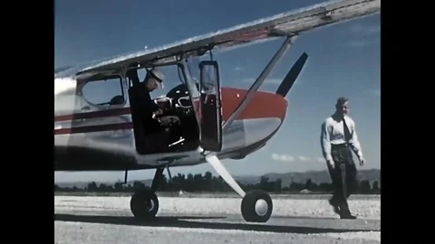 In the 1950s, businessmen learn to fly t... | Stock Video | Pond5