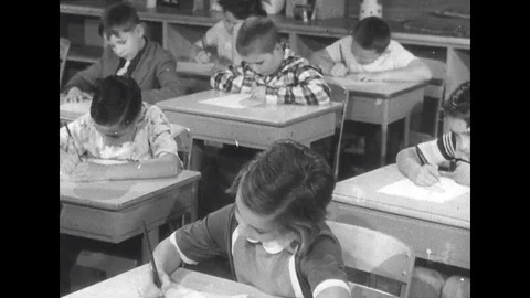 1950s: children writing on paper in clas... | Stock Video | Pond5