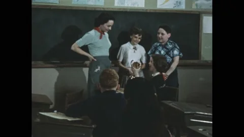 1950s: Classroom. Teacher talks to youn... | Stock Video | Pond5