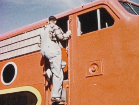 1950s: Conductors climb out of cab of tr... | Stock Video | Pond5