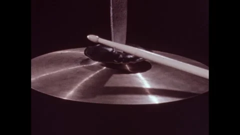 1950s: Cymbal, drum stick hits cymbal. P... | Stock Video | Pond5