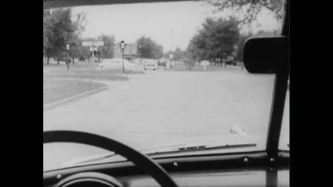 1950s: Driving in car down road. Car pul... | Stock Video | Pond5