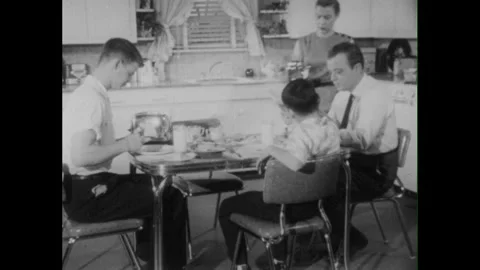 1950s: At family dinner, husband hands w... | Stock Video | Pond5
