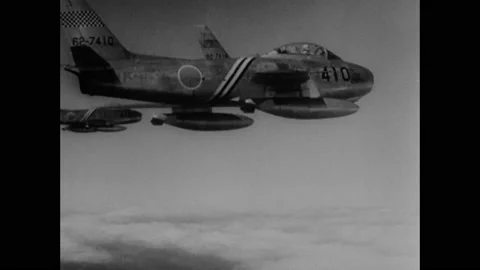 1950s: Four fighter jets fly in formatio... | Stock Video | Pond5
