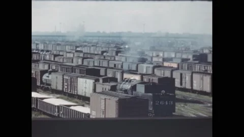 1950s: Freight trains in rail yard. Hous... | Stock Video | Pond5