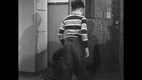 1950s: Girl reaches for object on high s... | Stock Video | Pond5