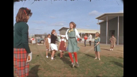 1950s: Girls jump rope on playground. Ch... | Stock Video | Pond5