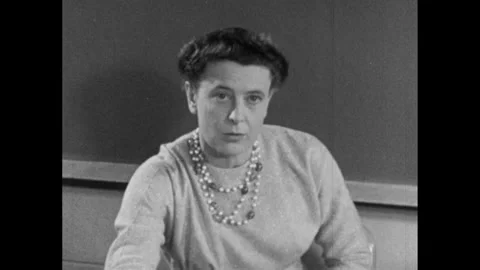 1950s: High school. Teacher speaks. St... | Stock Video | Pond5
