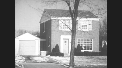 1950s: House in snowy neighborhood. View... | Stock Video | Pond5