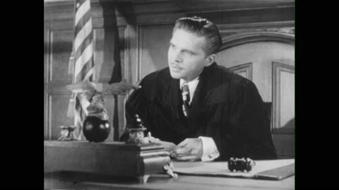 1950s: Judge talking at bench. Man in co... | Stock Video | Pond5