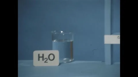 1950s: label with H2O in front of glass ... | Stock Video | Pond5