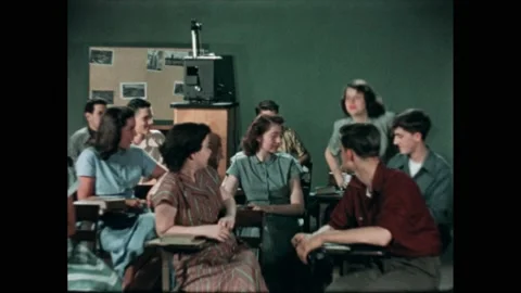 1950s: Male student speaks and sits in d... | Stock Video | Pond5