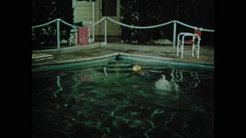 1950s: Man on diving board over pool rea... | Stock Video | Pond5