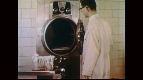 1950s: Man in lab coat puts vials and gl... | Stock Video | Pond5