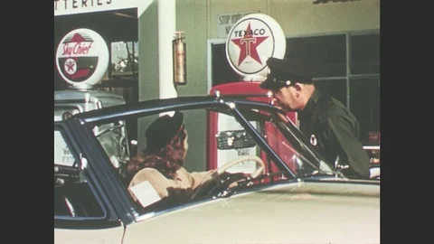 1950s: Man in Texaco uniform talks to wo... | Stock Video | Pond5