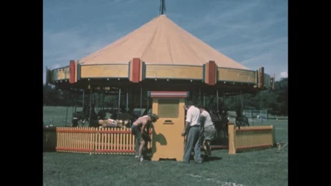 1950s: Men carry and setup a ticket boot... | Stock Video | Pond5