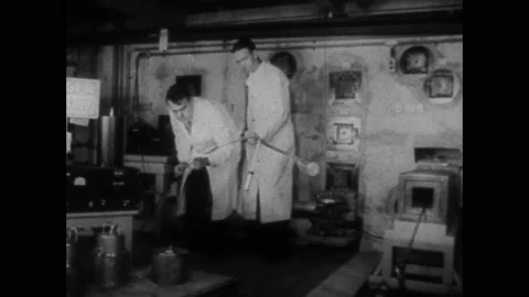 1950s: Men move radioactive materials to... | Stock Video | Pond5