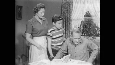 1950s: Mom, dad and son in dining room -... | Stock Video | Pond5