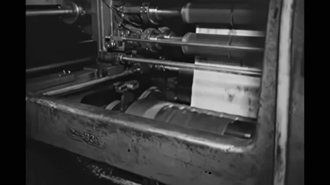1950s: Newspaper sheets rolling over pre... | Stock Video | Pond5