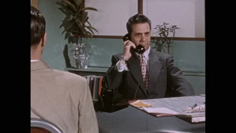 1950s: Office, man wears suit, sits at d... | Stock Video | Pond5