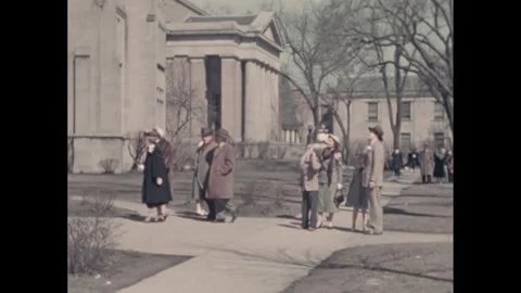 1950s: People walk outside on sidewalks.... | Stock Video | Pond5