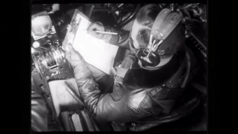 1950s: Pilot in cockpit of airplane writ... | Stock Video | Pond5