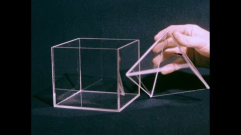 1950s: Plastic pyramid in box, hand pick... | Stock Video | Pond5