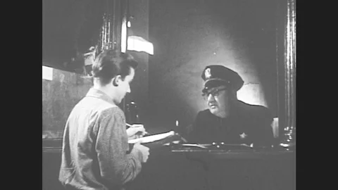 1950s: Police officer talks to teenager.... | Stock Video | Pond5