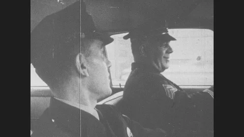 1950s: Police officers in car. Men hold ... | Stock Video | Pond5