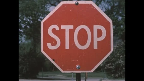 1950s: Road signs: Stop Ahead, Stop. Boy... | Stock Video | Pond5