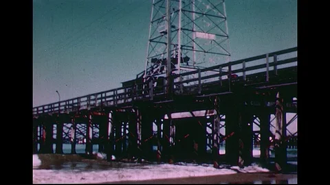 1950s: A shot of an offshore oil rig. A... | Stock Video | Pond5